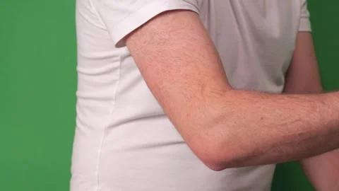 Man shows off an elbow brace's functiona... | Stock Video | Pond5