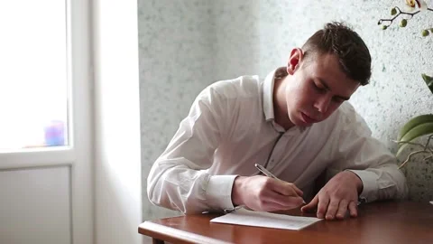 Man signs with a ballpoint pen on a whit... | Stock Video | Pond5