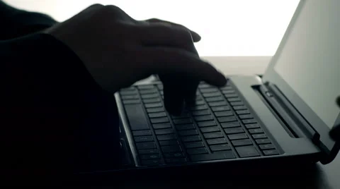 man in silhouette using an typing on a l... | Stock Video | Pond5