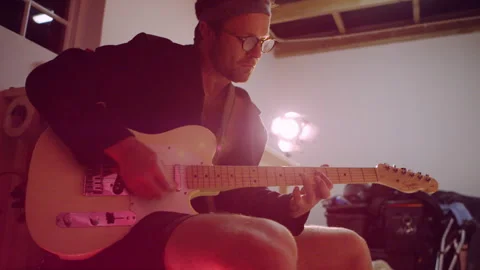 Man sitting and tapping his feet while s... | Stock Video | Pond5