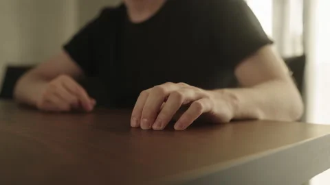 Man sitting in a chair and finger tappin... | Stock Video | Pond5