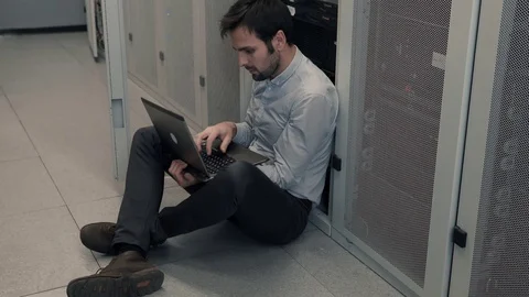Man Sitting On The Floor In Server Room ... | Stock Video | Pond5