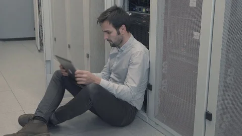 Man Sitting On The Floor In Server Room ... | Stock Video | Pond5