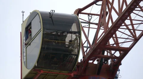Man sitting in a tower crane cockpit in ... | Stock Video | Pond5
