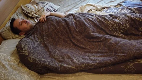 Man sleeping and waking up alone in the ... | Stock Video | Pond5