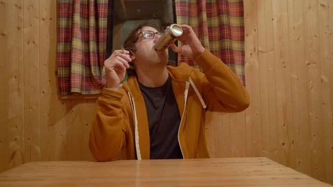 Man Smoking and Drinking Beer at a Table... | Stock Video | Pond5