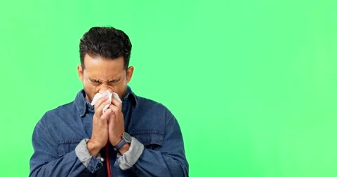 Man sneezing, blowing nose on green scre... | Stock Video | Pond5