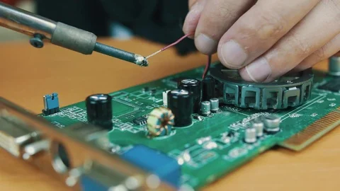 The man solders a chip | Stock Video | Pond5