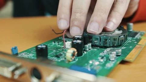 The man solders a chip | Stock Video | Pond5