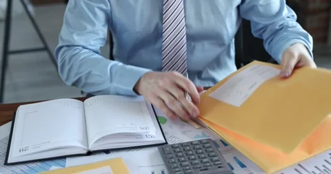 Man sorting letters in yellow envelopes ... | Stock Video | Pond5