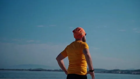 Man in sportswear does warm-up of muscle... | Stock Video | Pond5