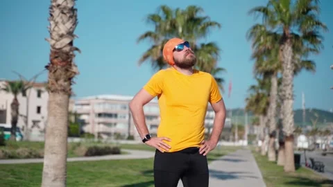 Man in sportswear does warm-up of muscle... | Stock Video | Pond5