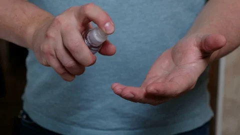 man spray on hands antiseptic for protec... | Stock Video | Pond5