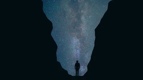 The man stand in a canyon on the backgro... | Stock Video | Pond5