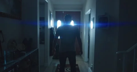 Man standing at door of ghostly alien ab... | Stock Video | Pond5