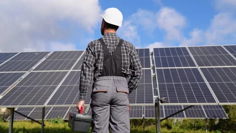 Man standing near solar panels. Back vie... | Stock Video | Pond5
