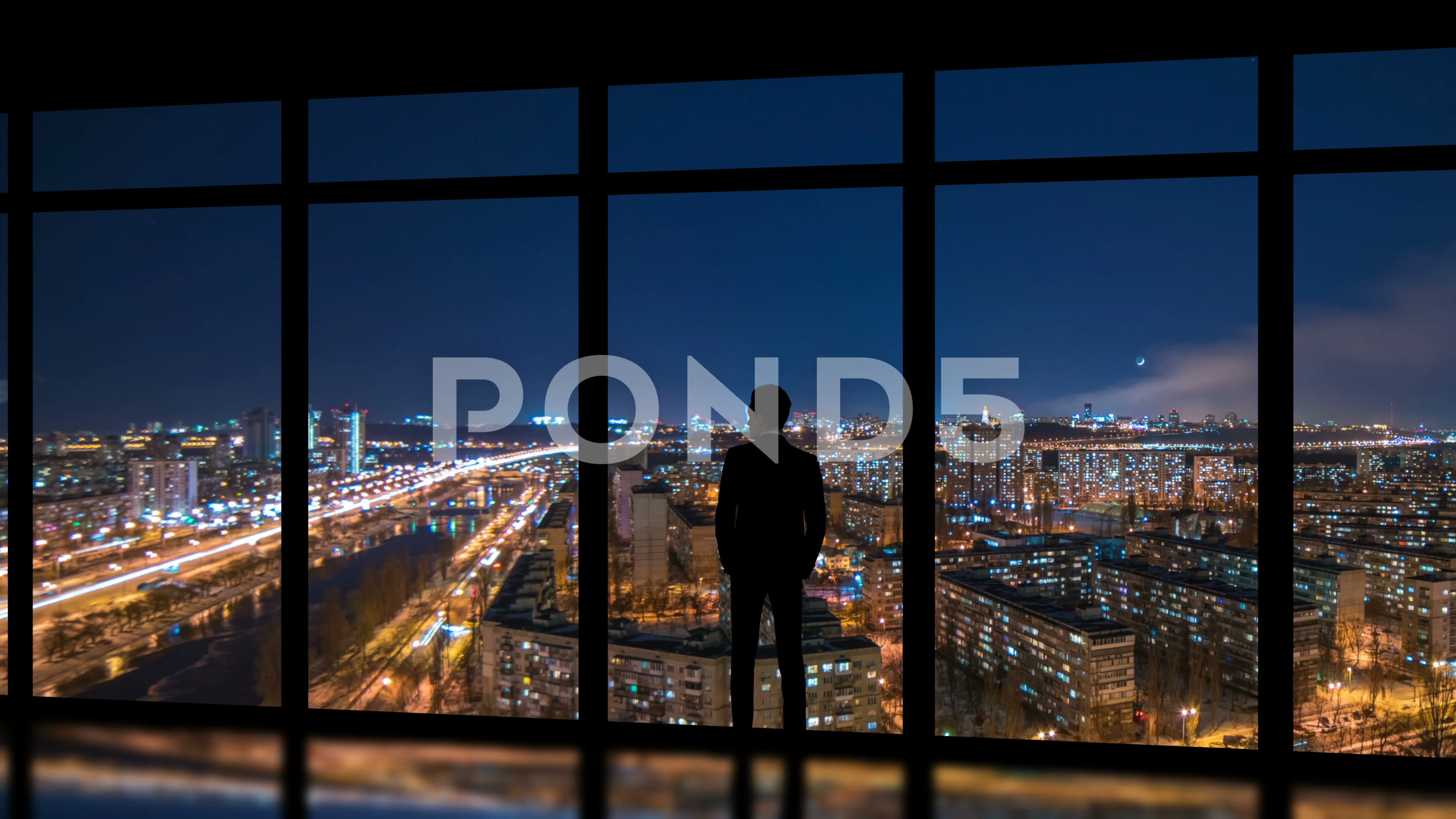 Man Looking Out Window At Night