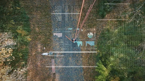 Man stands in autumn forest holding futu... | Stock Video | Pond5