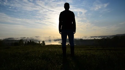 the man stands with his arms spread wide... | Stock Video | Pond5