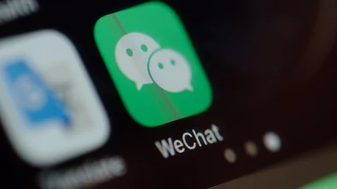 Man starting WeChat app on a smartphone | Stock Video | Pond5