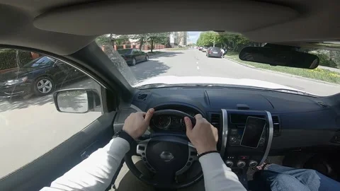 man steering driving car point of view | Stock Video | Pond5
