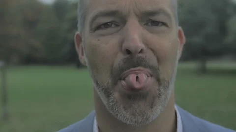 Man Sticks Out Tongue Provocative and Ro... | Stock Video | Pond5