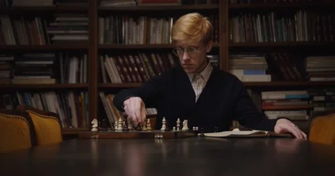 A man is studying with concentration to ... | Stock Video | Pond5