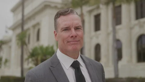 Man in Suit Standing Outside Building | Stock Video | Pond5