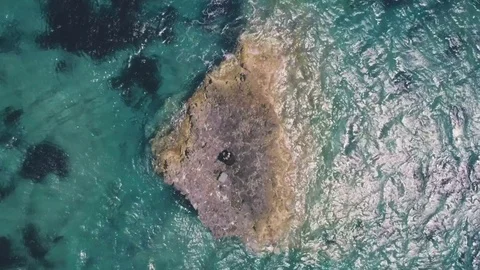 Man in suit stranded on a deserted rock ... | Stock Video | Pond5