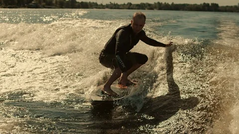 Man surfing on waves in slow motion. Wak... | Stock Video | Pond5