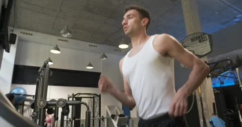Man sweating while running on a treadmil... | Stock Video | Pond5