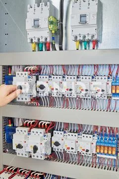 Man switch switch protection engine to check in the electrical Cabinet ...