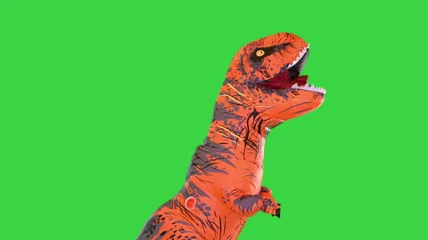 Man in a t-rex costume running on a Gree... | Stock Video | Pond5