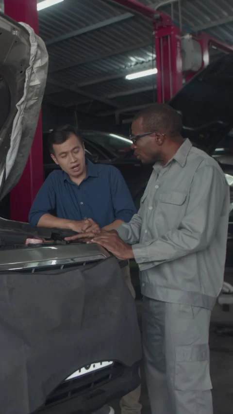 Man Talking to Mechanic Examining Breakd... | Stock Video | Pond5