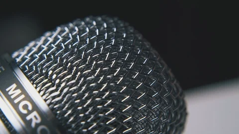 man taps on shining microphone by finger... | Stock Video | Pond5