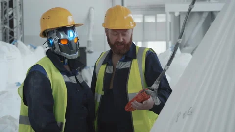 Man Teaching Robot How To Use Lifting Ho... | Stock Video | Pond5