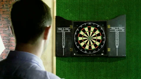 Man throwing a dart arrow in target cent... | Stock Video | Pond5