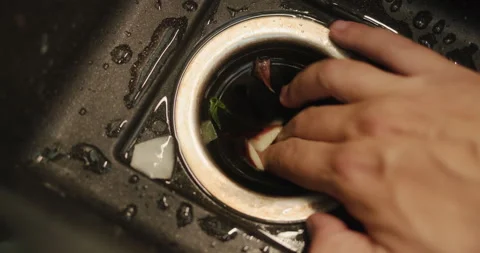 Man throwing food waste into the garbage... | Stock Video | Pond5