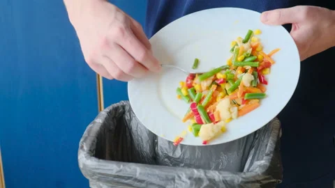 A man throwing unfinished food into the ... | Stock Video | Pond5