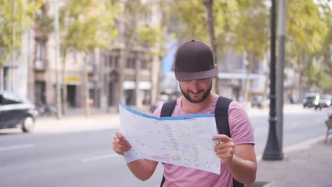 Man tourist planning route with map and ... | Stock Video | Pond5