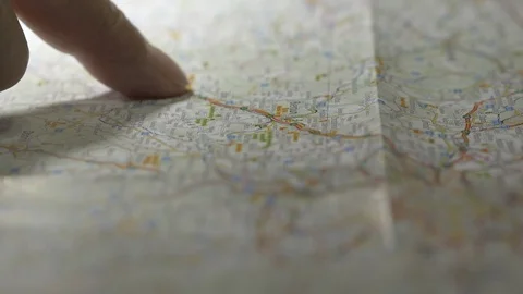 Man Traces Route On Map Reading And Taps... | Stock Video | Pond5
