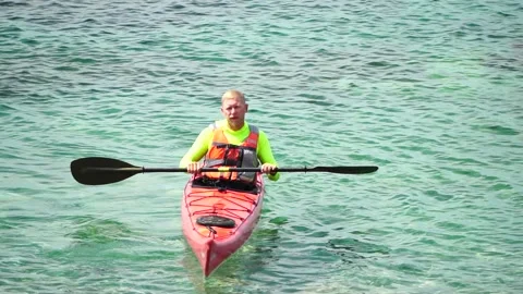Man trains in kayak eskimo roll, slow mo... | Stock Video | Pond5