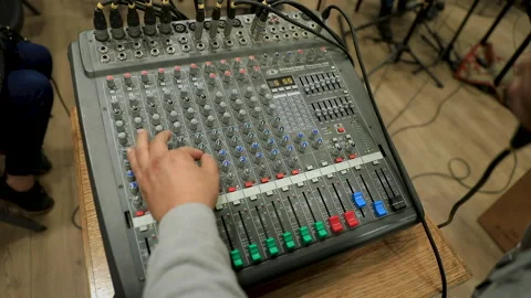 A man tuning microphone volume with an a... | Stock Video | Pond5