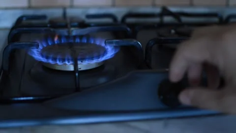 man turning off the gas on the kitchen s... | Stock Video | Pond5