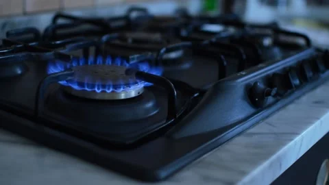 man turning off the gas on the kitchen s... | Stock Video | Pond5