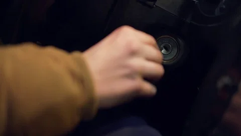 Man turning ignition key in car. Close u... | Stock Video | Pond5