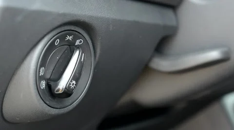 man turns on daylight of modern car - de... | Stock Video | Pond5