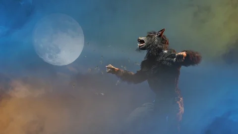 man turns into a werewolf on a dark back... | Stock Video | Pond5
