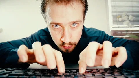 Man type on keyboard and stare into came... | Stock Video | Pond5