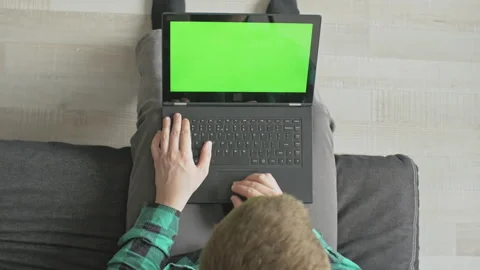 Man typing and scrolling on his laptop w... | Stock Video | Pond5